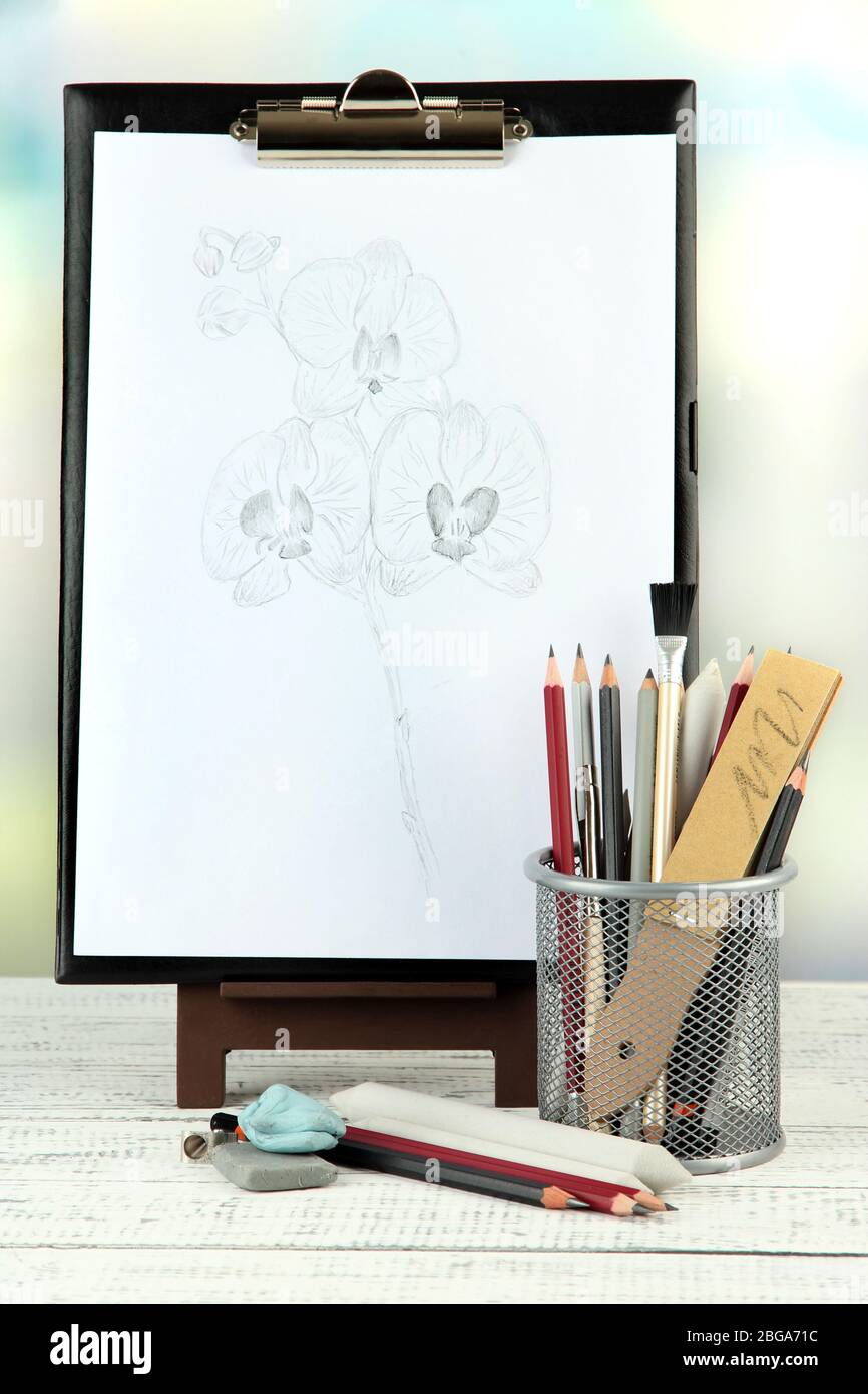 Sketch with professional art materials, on wooden table Stock Photo - Alamy