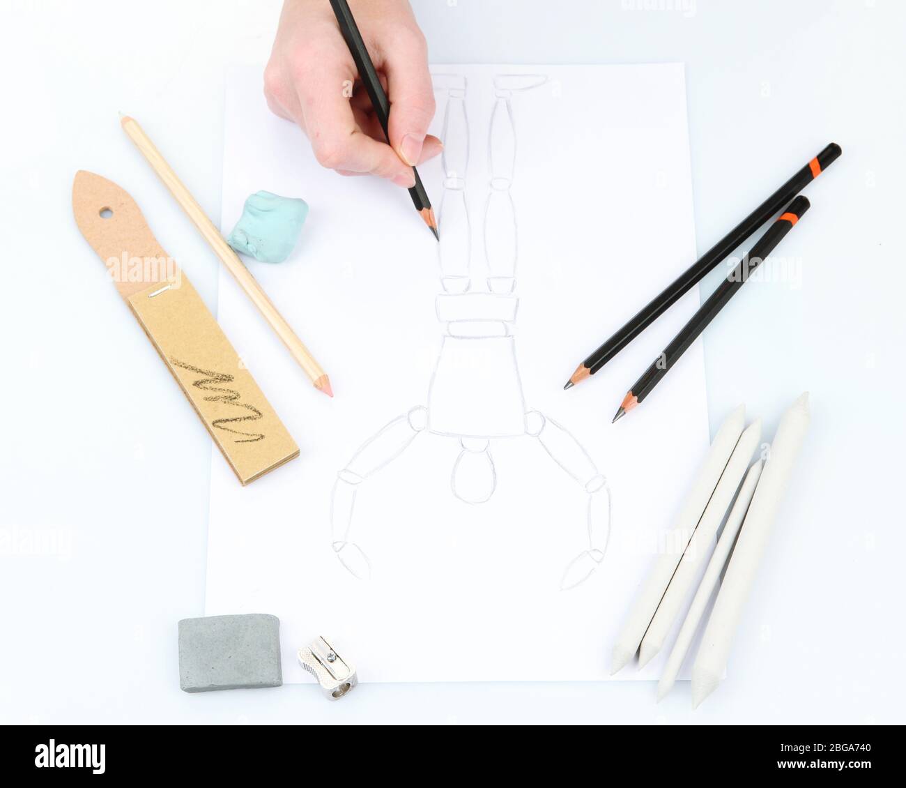 Hand draws a sketch with professional art materials, isolated on white ...