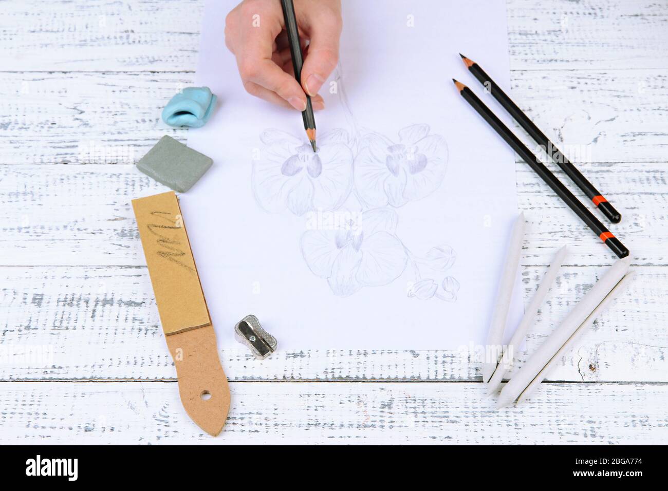 Hand draws a sketch with professional art materials, isolated on white ...