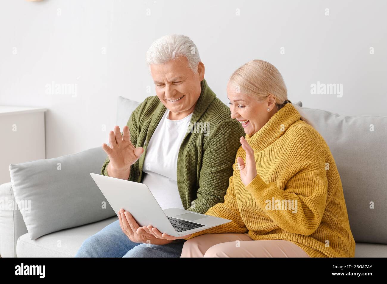 Senior couple video chatting at home Stock Photo - Alamy