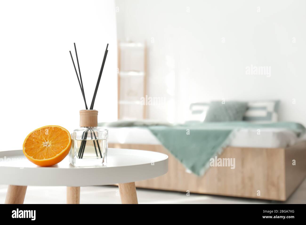 Reed diffuser on table in bedroom Stock Photo - Alamy