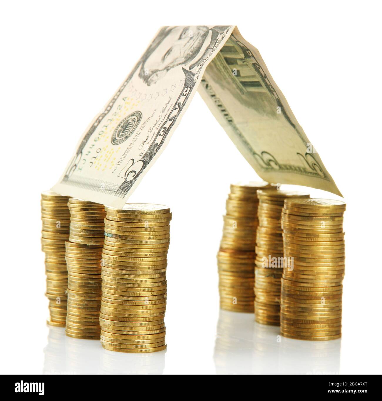 Coins house isolated on white Stock Photo - Alamy