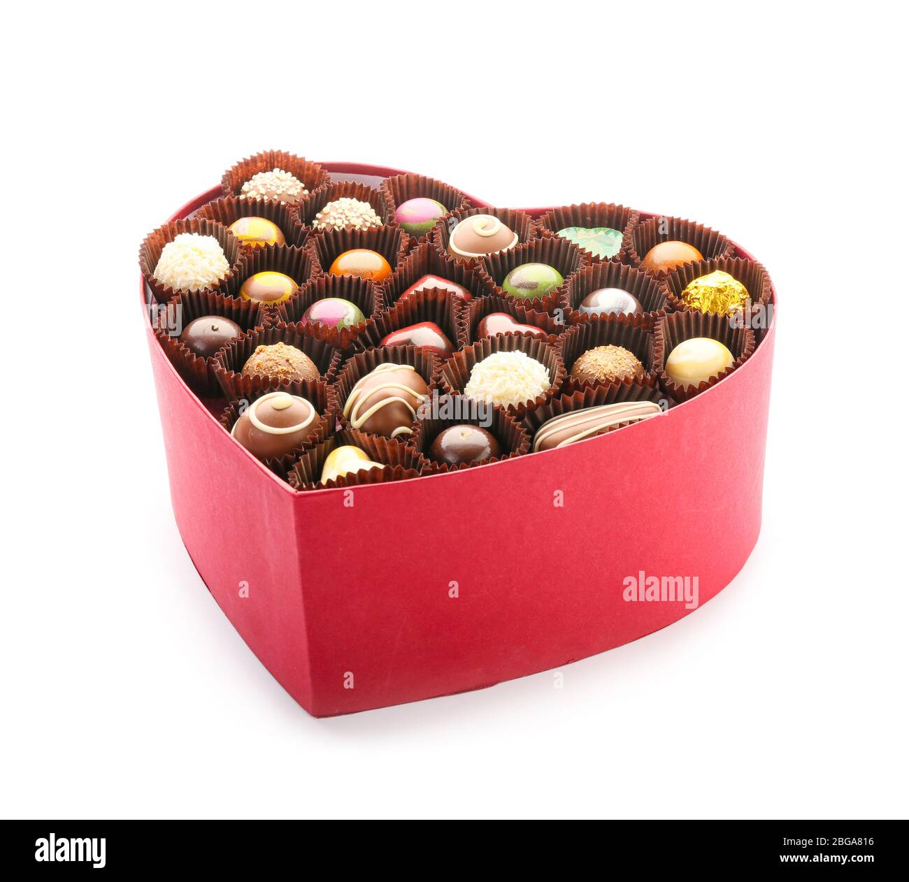 Heart-shaped box with delicious candies on white background Stock Photo ...