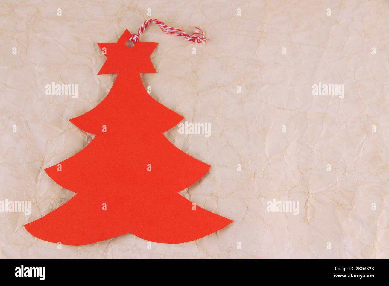 Red label on paper background Stock Photo - Alamy