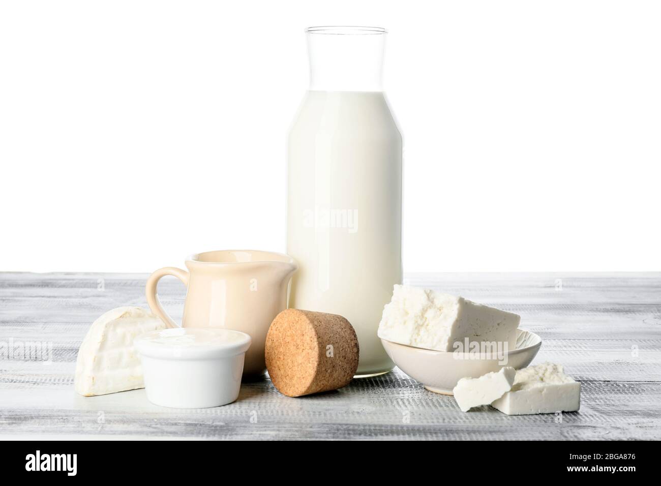 Different dairy products on table against white background Stock Photo ...