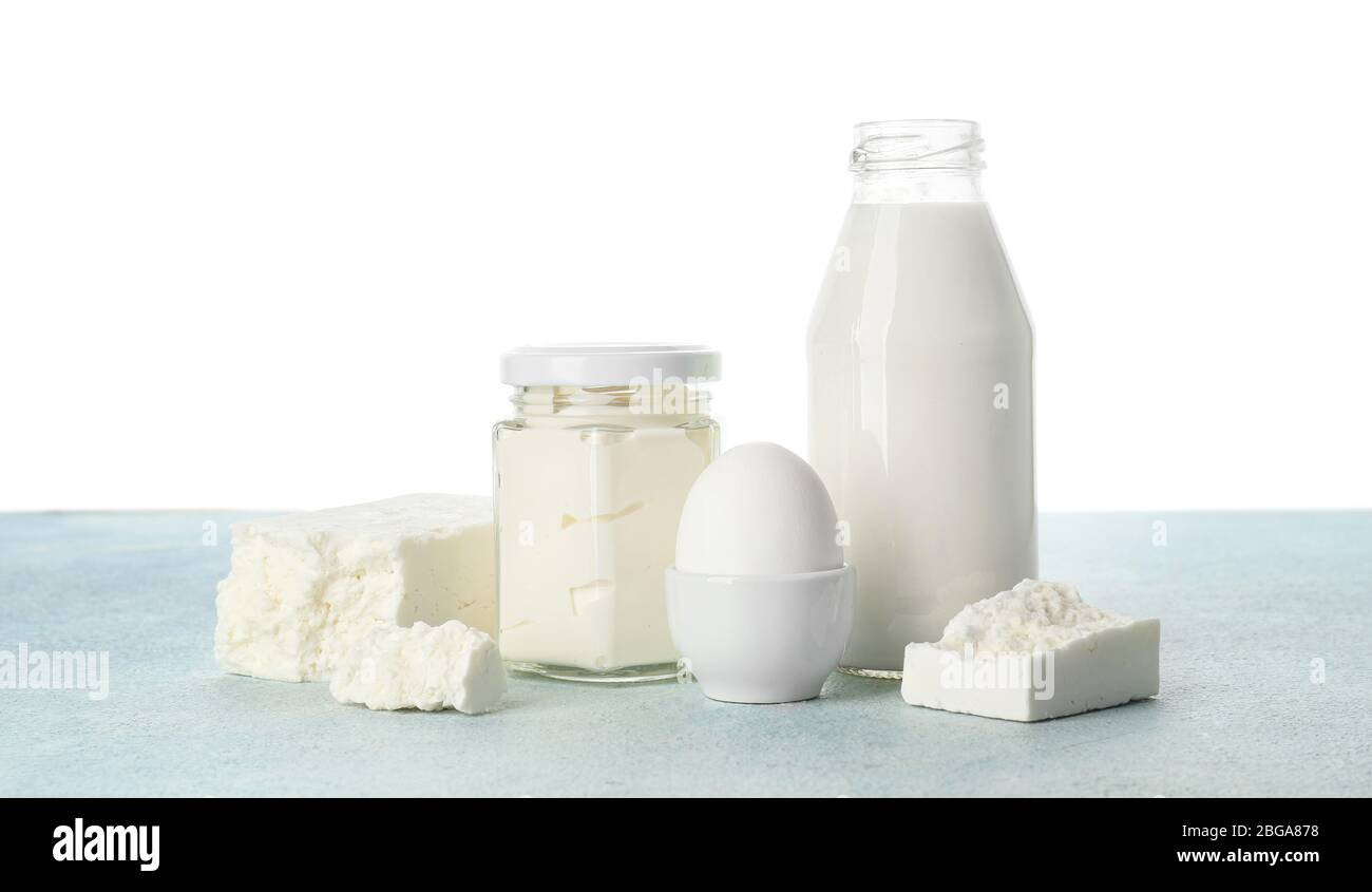 Different dairy products on table against white background Stock Photo ...