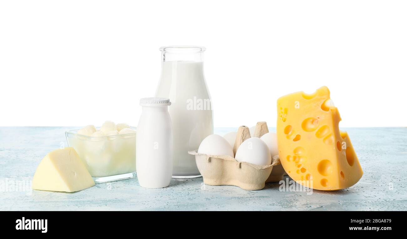 Different dairy products on table against white background Stock Photo ...