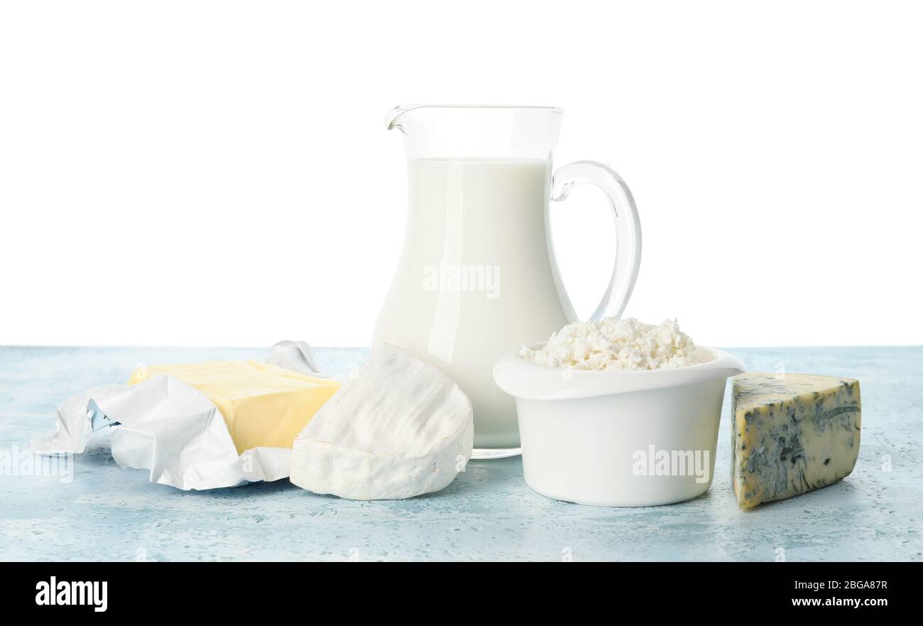 Different dairy products on table against white background Stock Photo ...