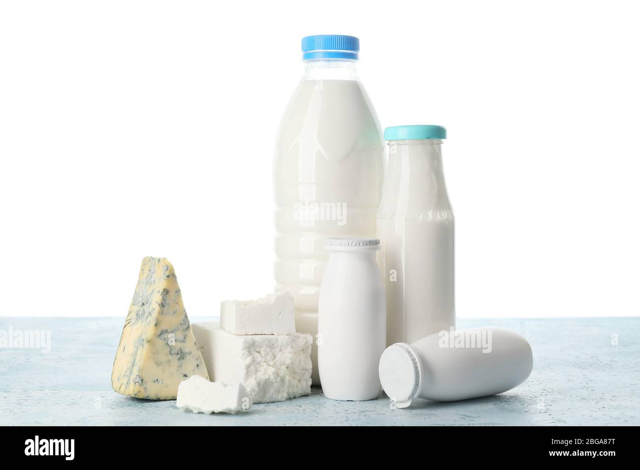 Different dairy products on table against white background Stock Photo ...
