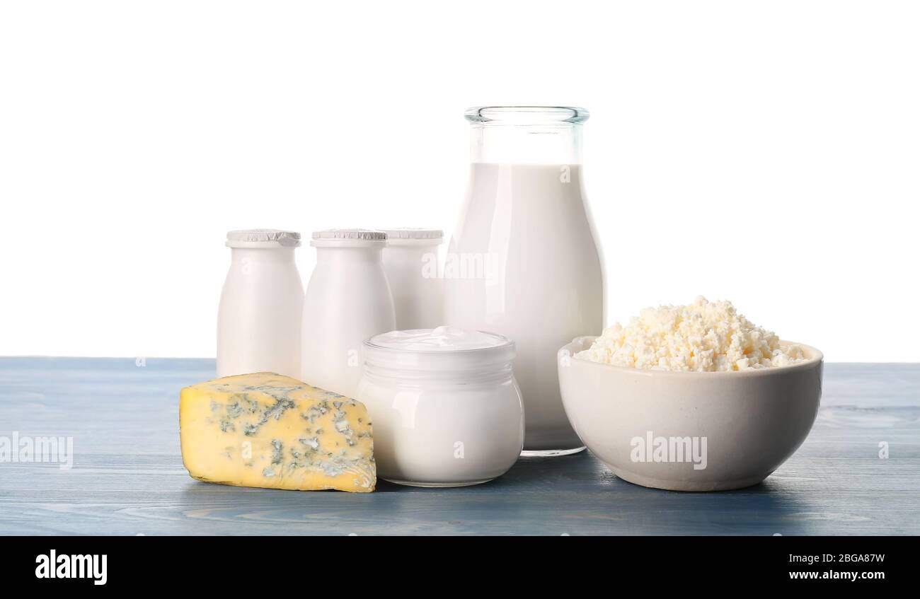 Different dairy products on table against white background Stock Photo ...