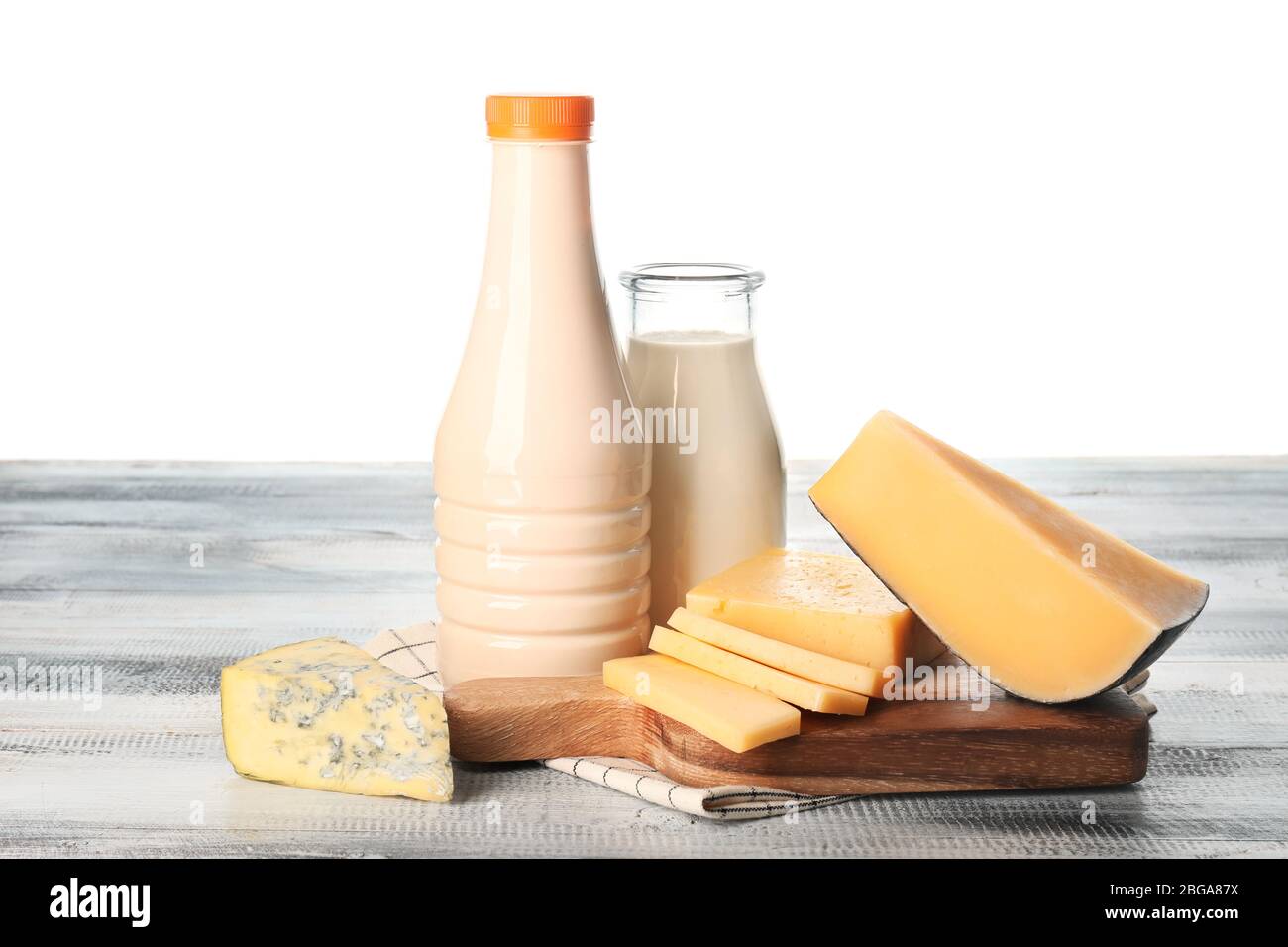 Different dairy products on table against white background Stock Photo ...