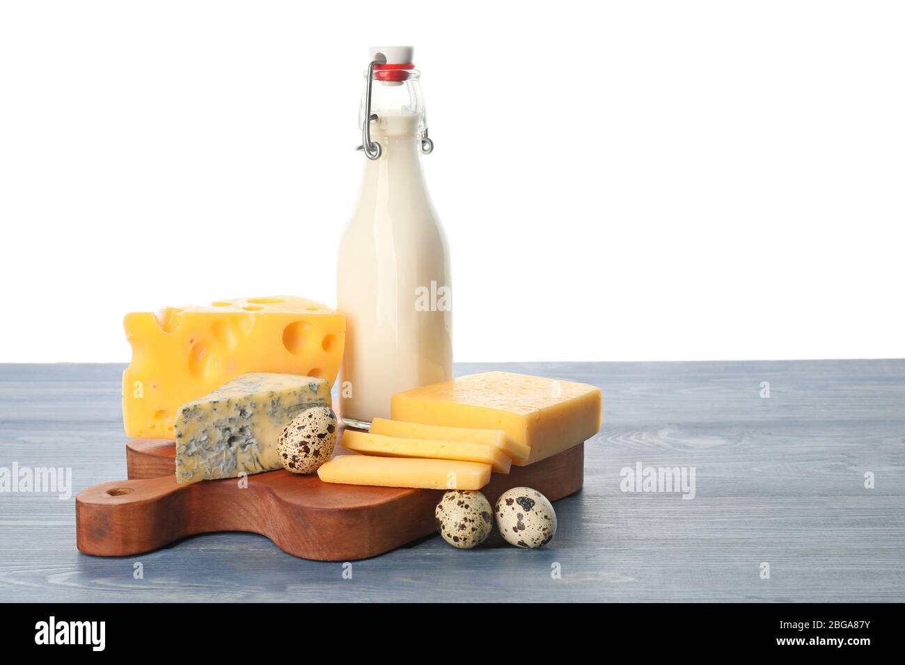 Different dairy products on table against white background Stock Photo ...