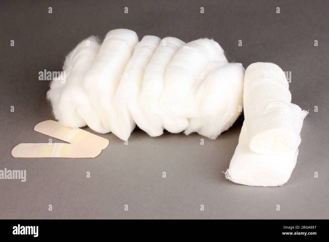 Wadding, bandage and patch on grey background Stock Photo - Alamy