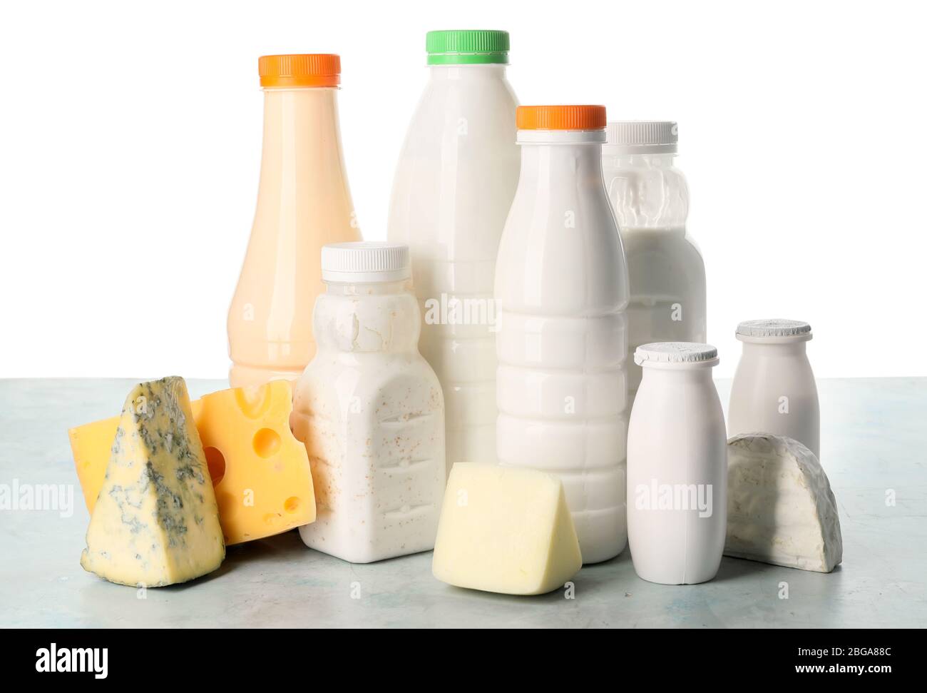 Different dairy products on table against white background Stock Photo ...