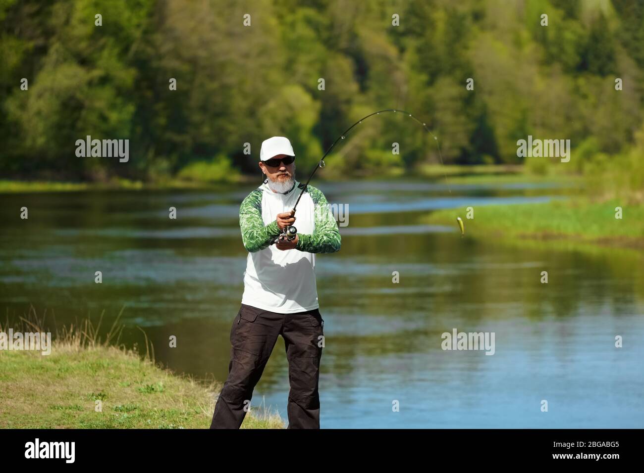Throwing fishing rod hi-res stock photography and images - Alamy