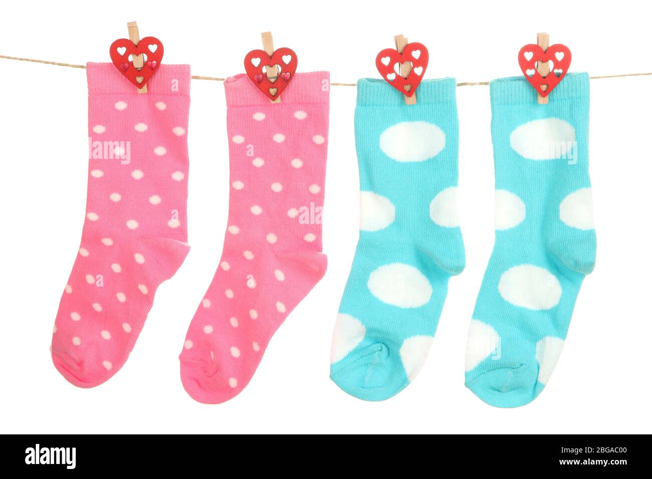 Socks hanging on clothesline isolated on white Stock Photo - Alamy