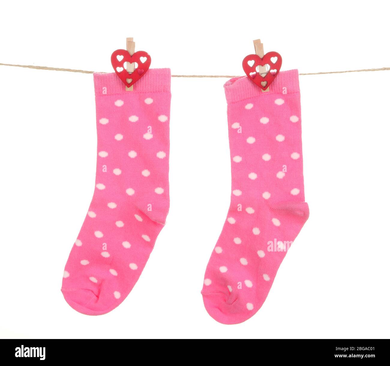 Socks hanging on clothesline isolated on white Stock Photo - Alamy