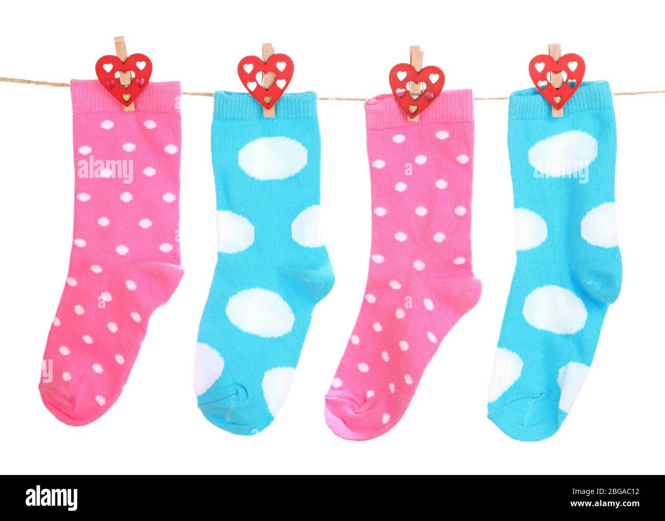 Socks hanging on clothesline isolated on white Stock Photo - Alamy