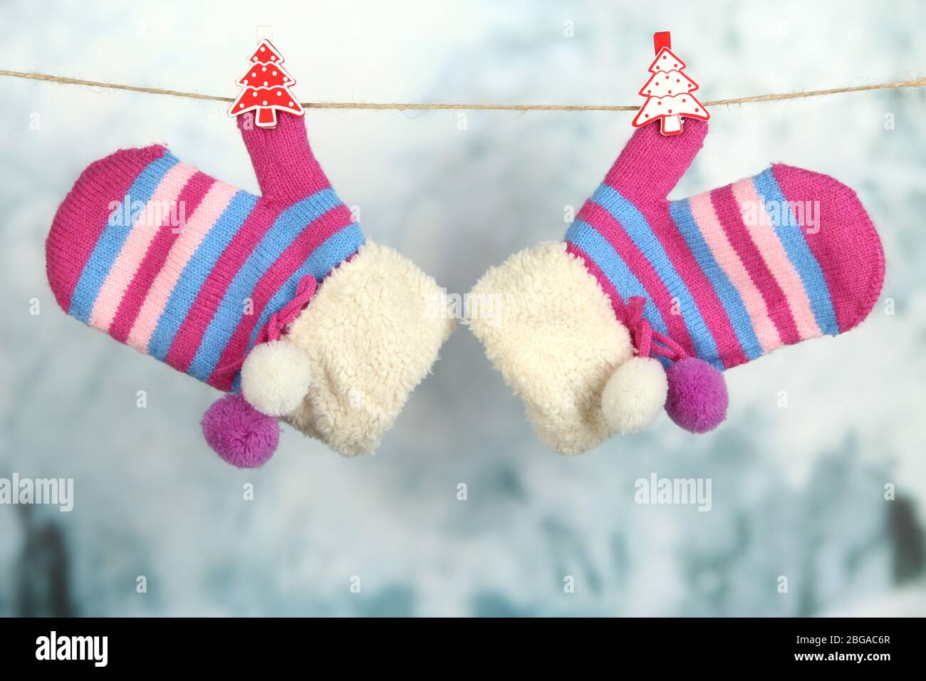 Red knit gloves hanging hi-res stock photography and images - Alamy