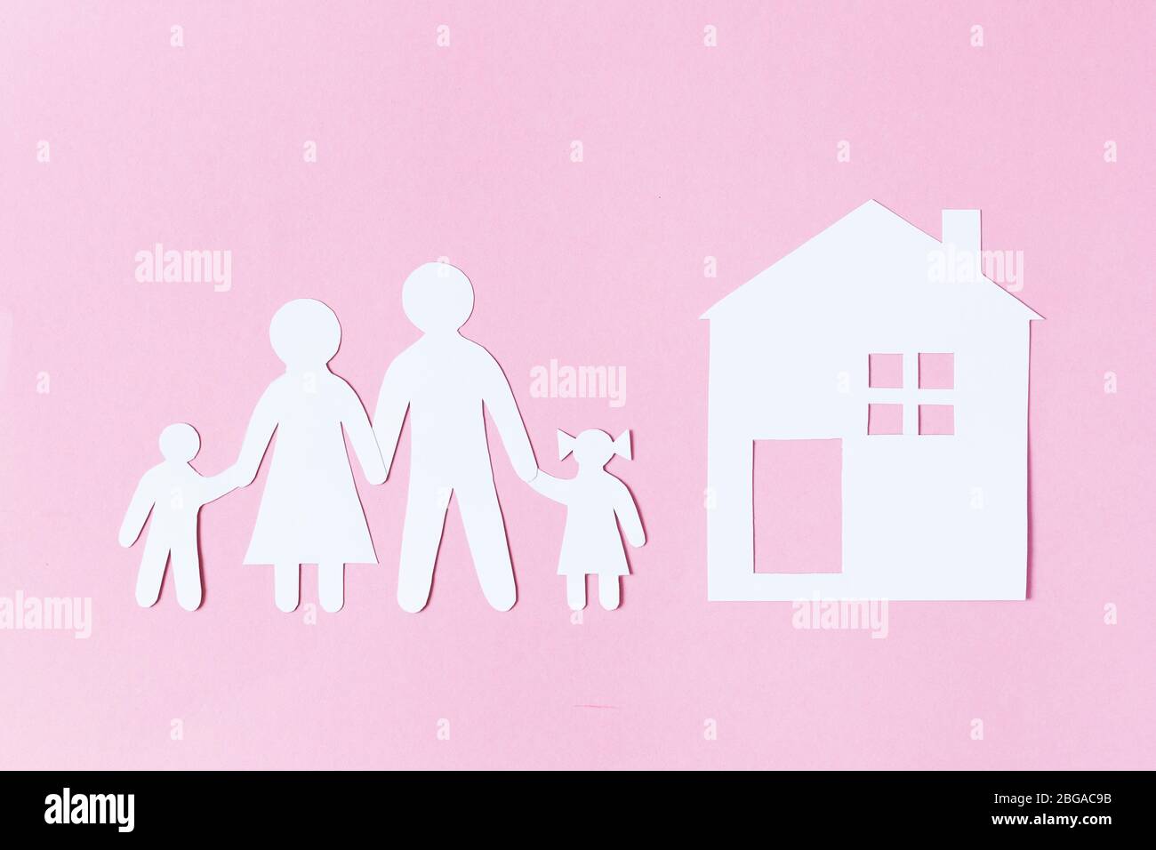 Lovely paper family with house on pink background top view. Happy ...
