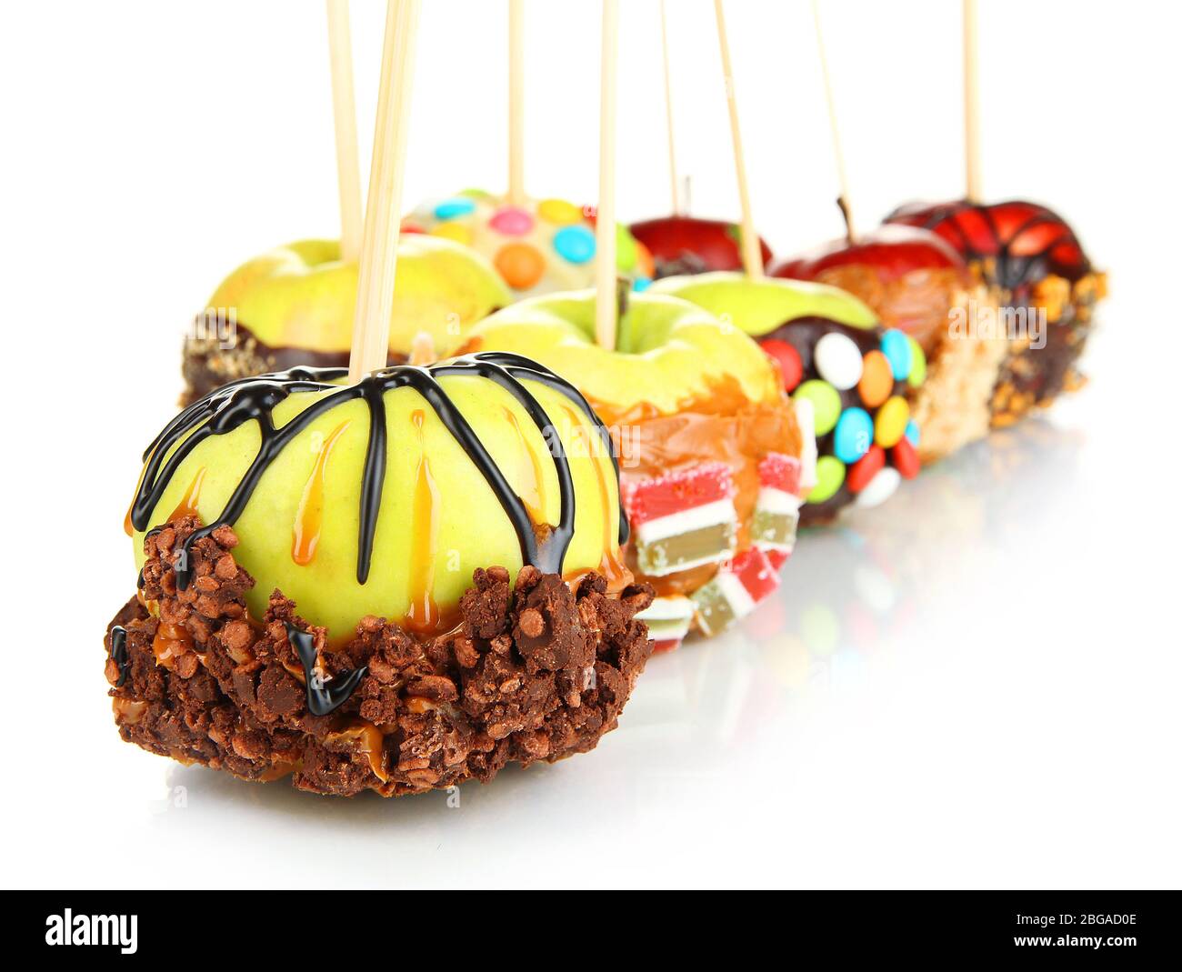 Candied apple on stick isolated on white Stock Photo - Alamy