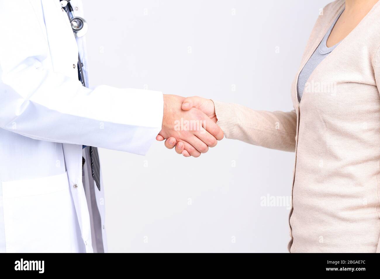 Doctor and patient, close-up, isolated on white background Stock Photo ...