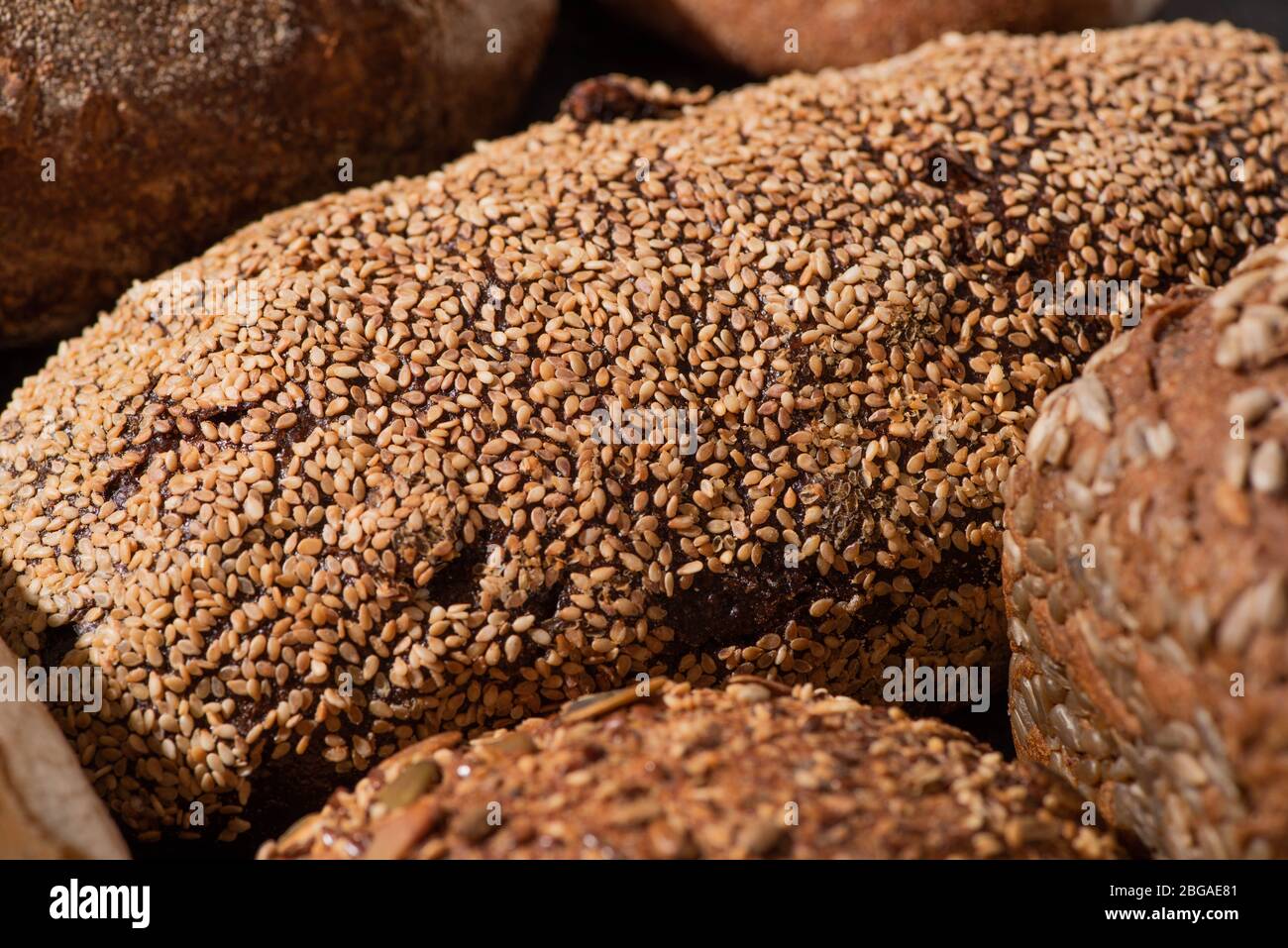 close up view of fresh baked brown whole grain bread Stock Photo - Alamy