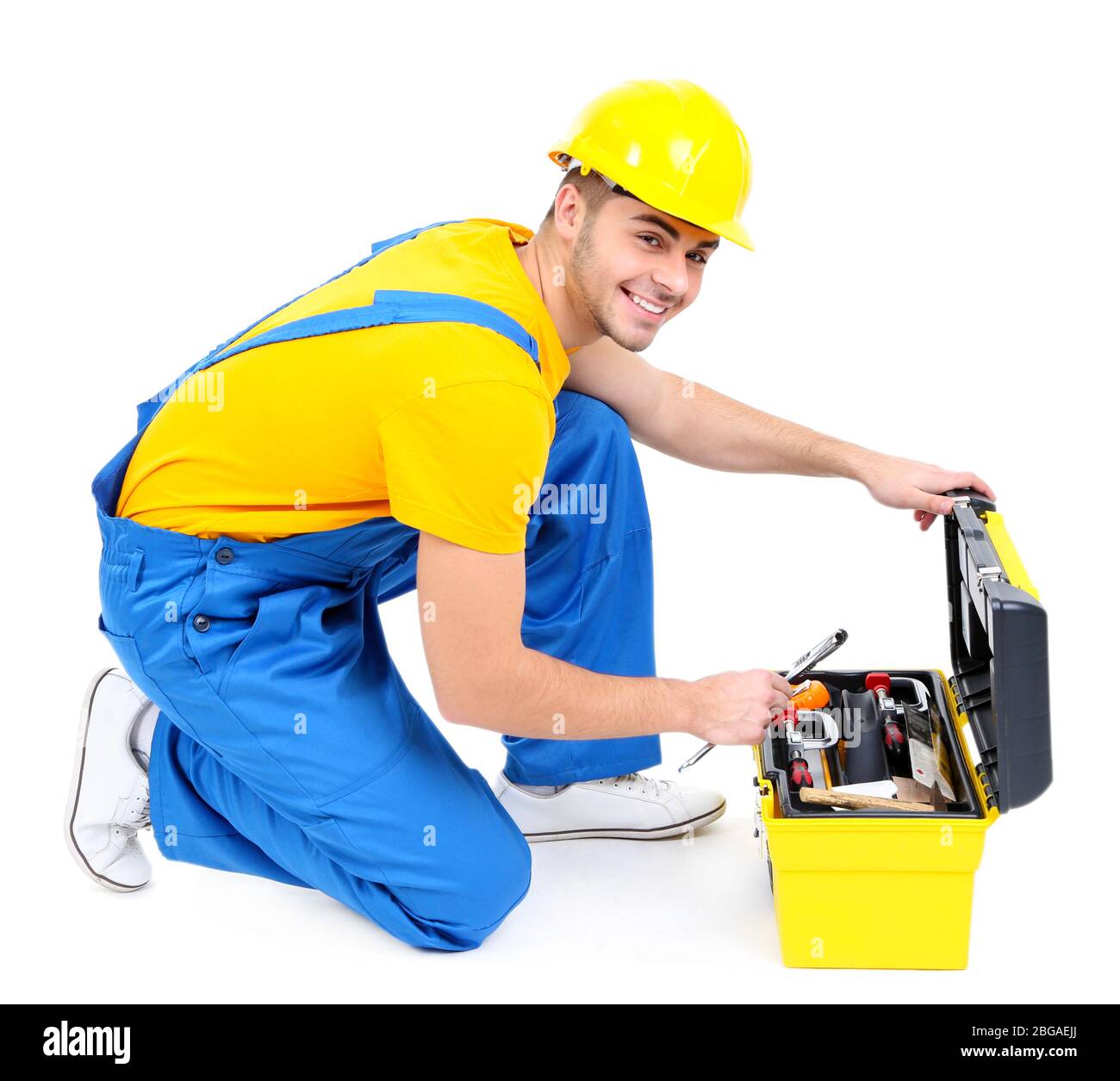 Male builder in yellow helmet hi-res stock photography and images - Alamy