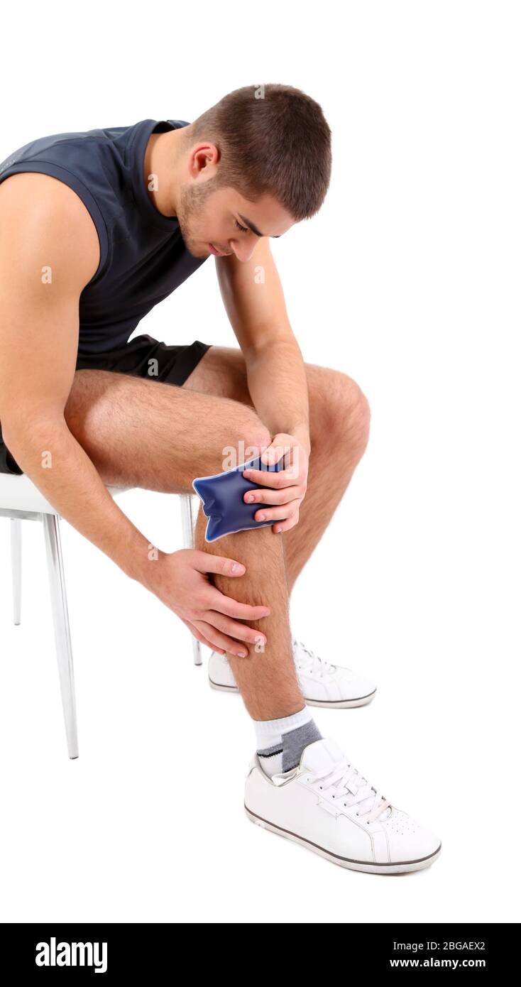 Young man with knee pain, isolated on white Stock Photo - Alamy