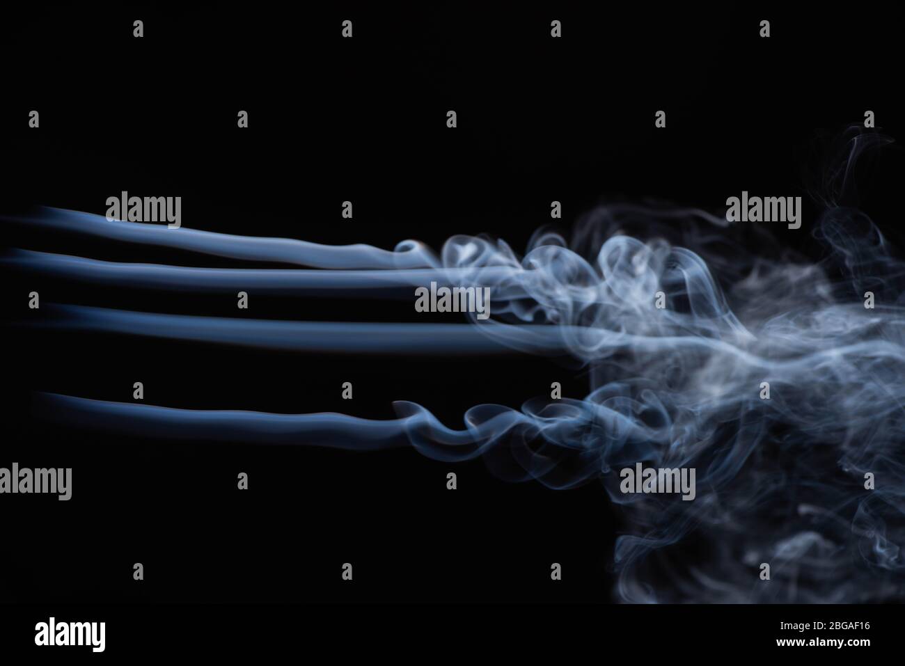 white flowing smoke cloud on black background Stock Photo - Alamy