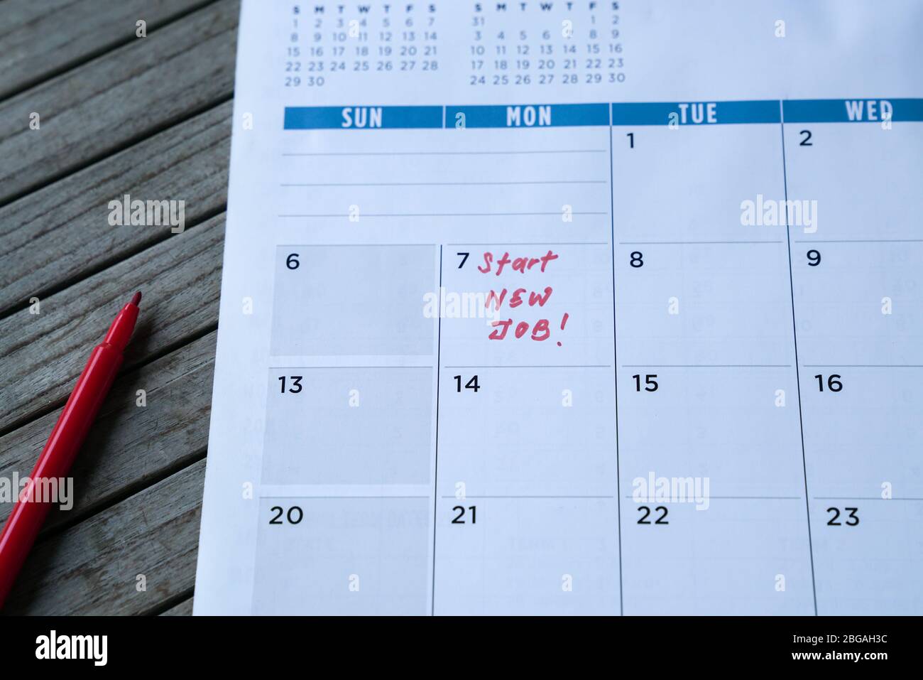 Start new job words written on table calendar with red marker ...