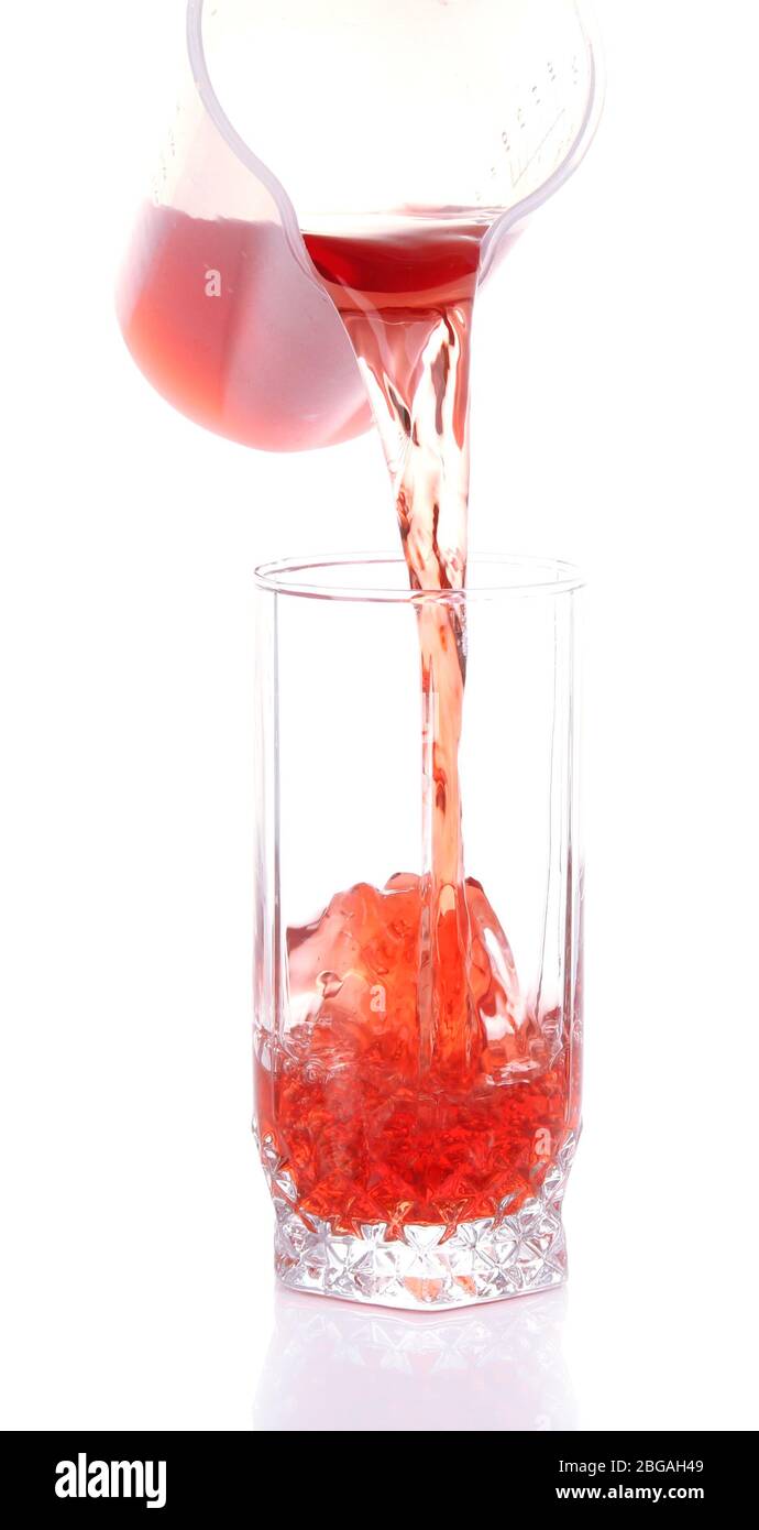 Juice pouring into glass isolated on white Stock Photo - Alamy