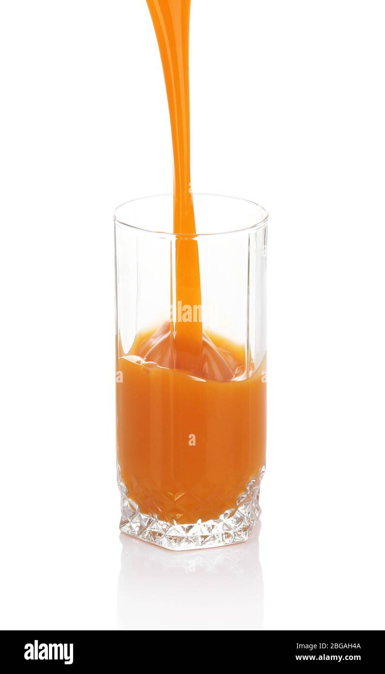 Juice pouring into glass isolated on white Stock Photo - Alamy