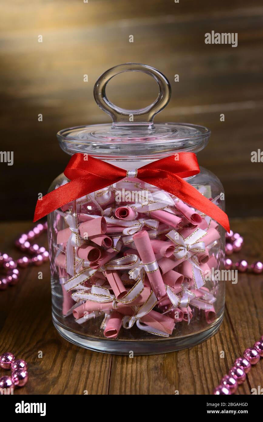 Paper notes with wishes on table on wooden background Stock Photo - Alamy