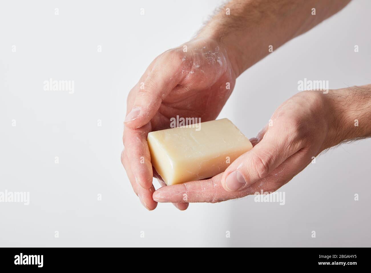 partial view of man using soap on grey background background Stock ...