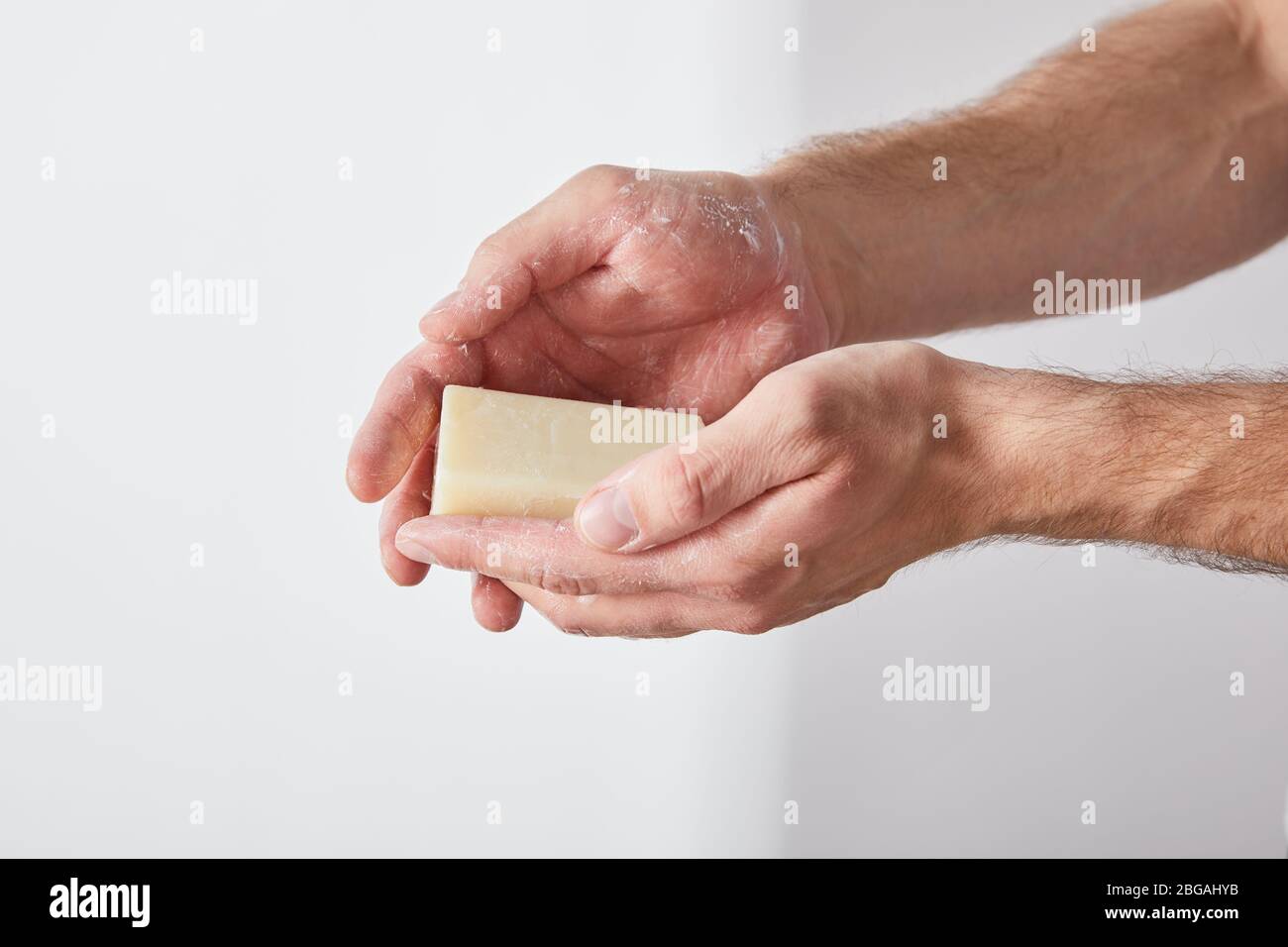 partial view of man using soap on grey background background Stock ...