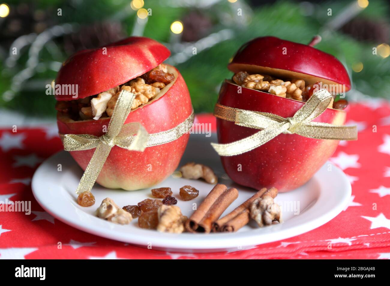 Stuffed Christmas apples with nuts and raisins on table close up Stock ...
