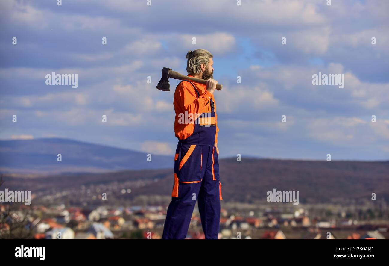 Hard labour. Use axe construction. Renovation tools. Handsome guy ...
