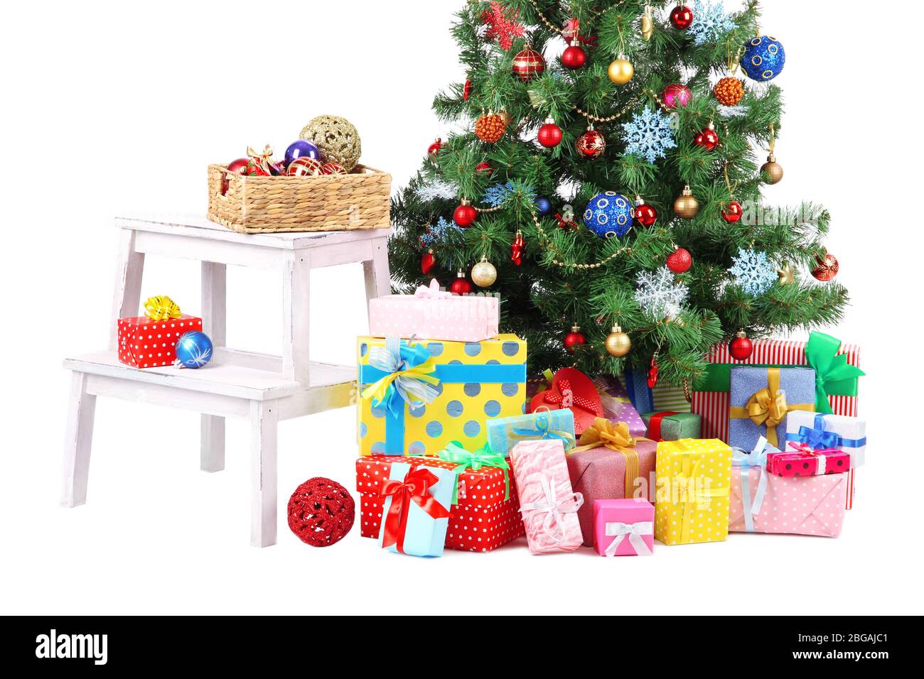 Decorated Christmas tree with gifts isolated on white Stock Photo - Alamy