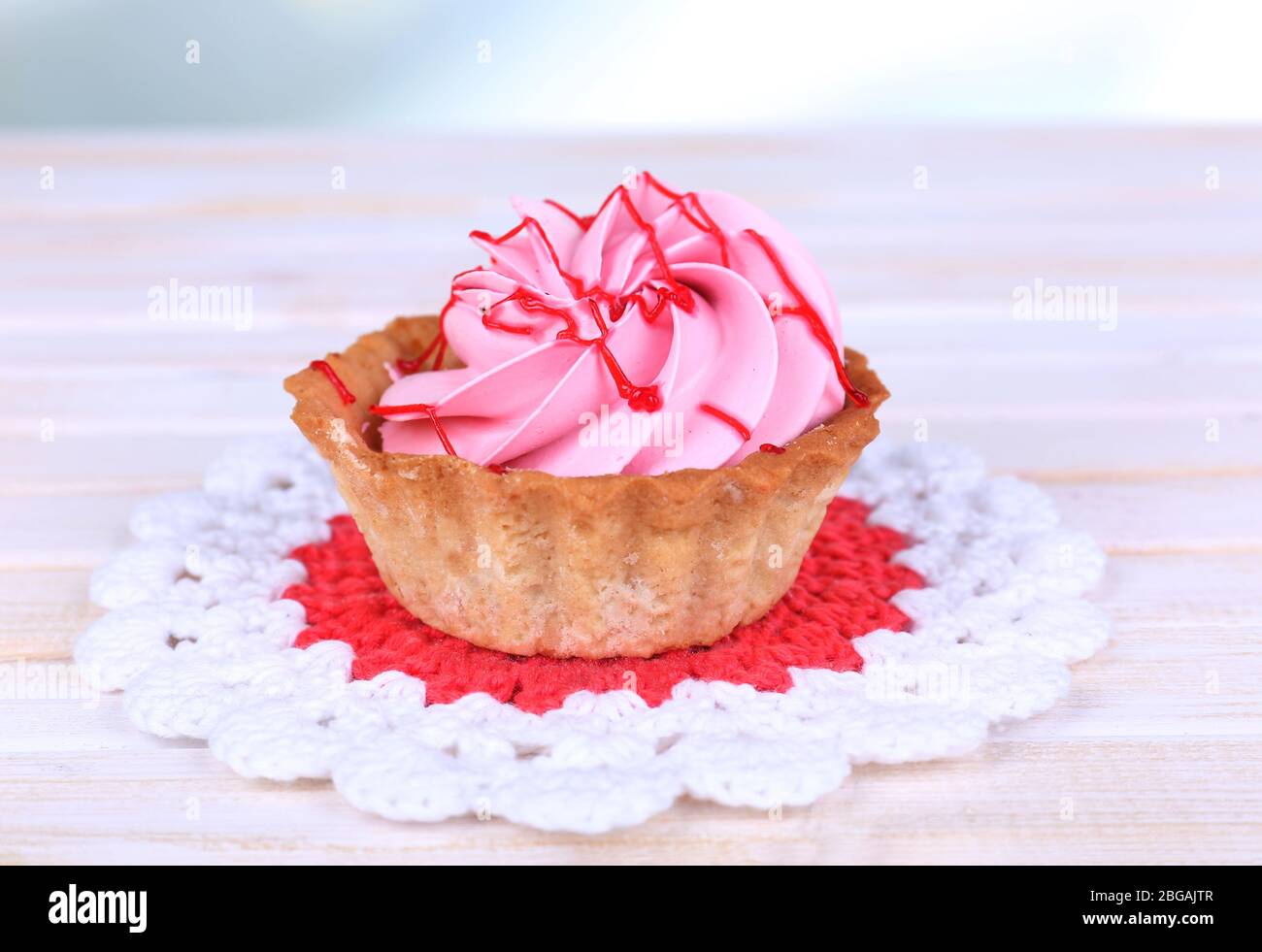 Tasty cake on table on light background Stock Photo - Alamy
