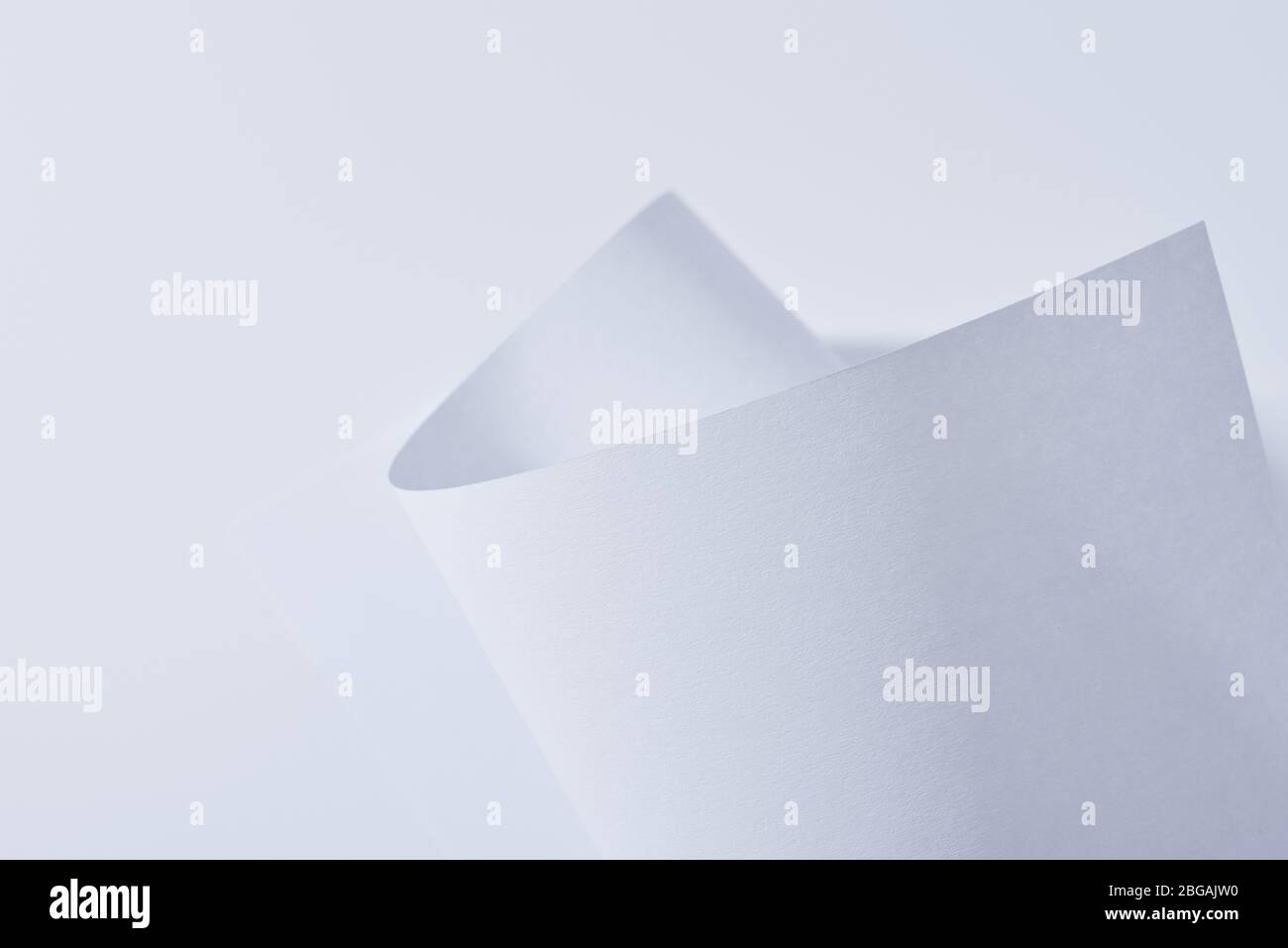 close up view of curved paper sheet isolated on white Stock Photo - Alamy