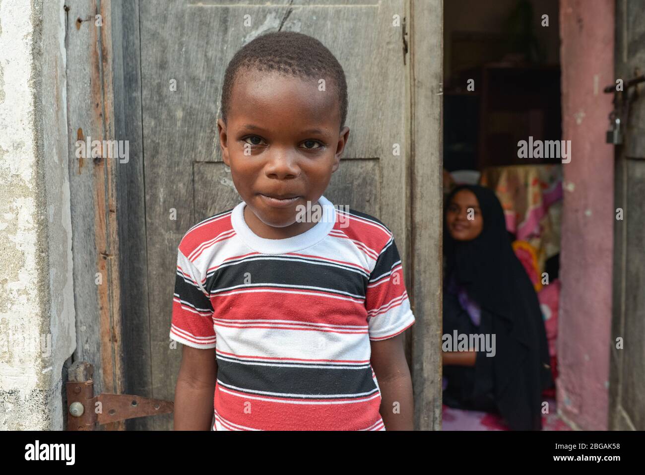 Lamu, Kenya - December 15, 2016: cute kid in the narrow alleys of Lamu ...