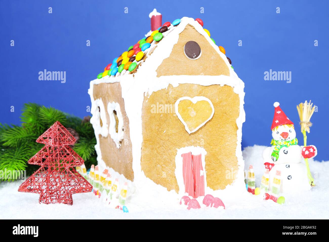 Gingerbread house on blue background Stock Photo - Alamy
