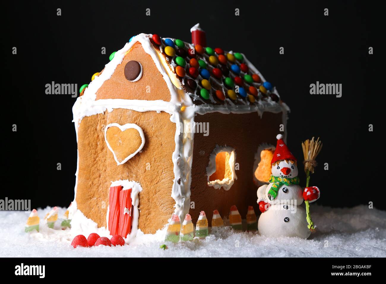 Gingerbread house on black background Stock Photo - Alamy