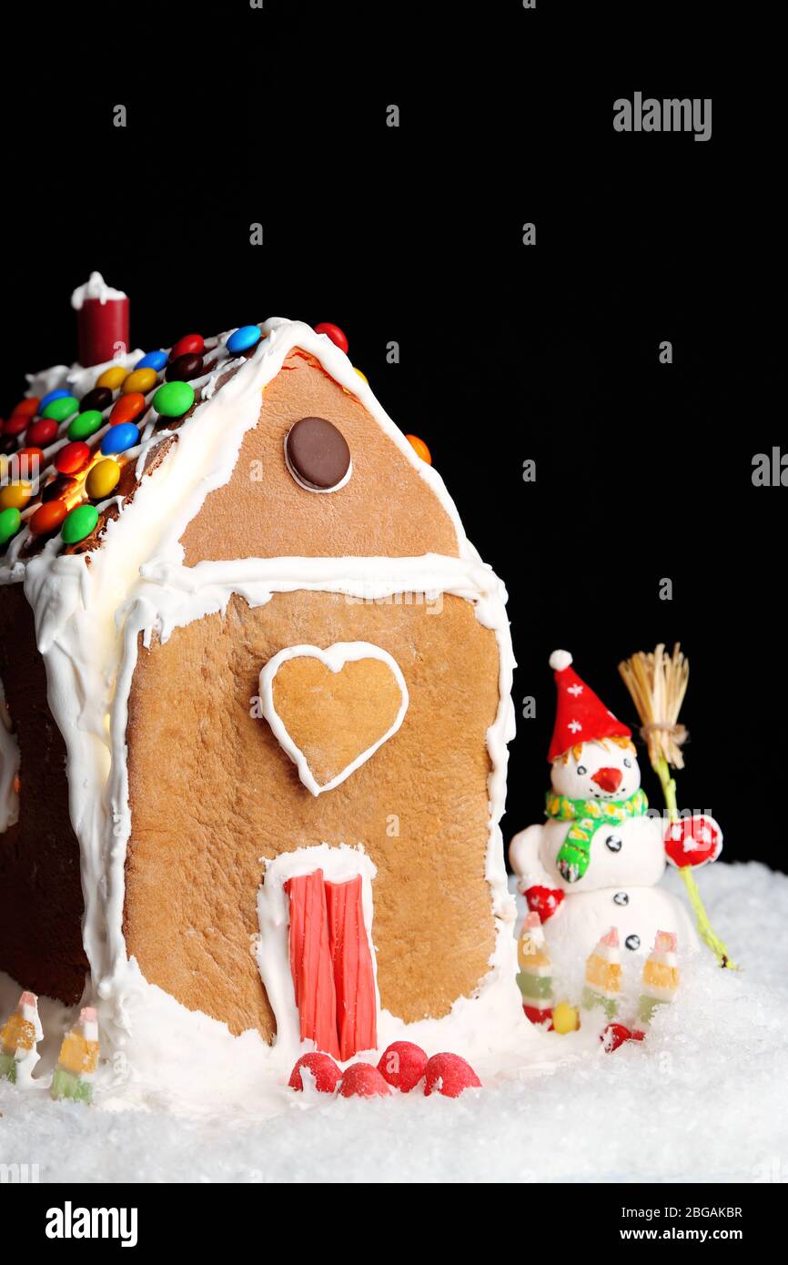 Gingerbread house on black background Stock Photo - Alamy
