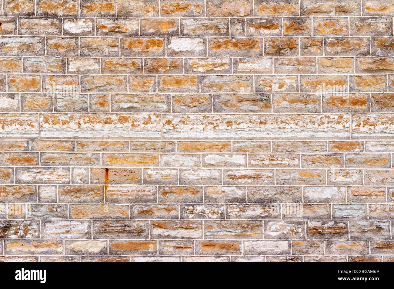 Attractive old preserved 19th Century brown limestone building wall ...