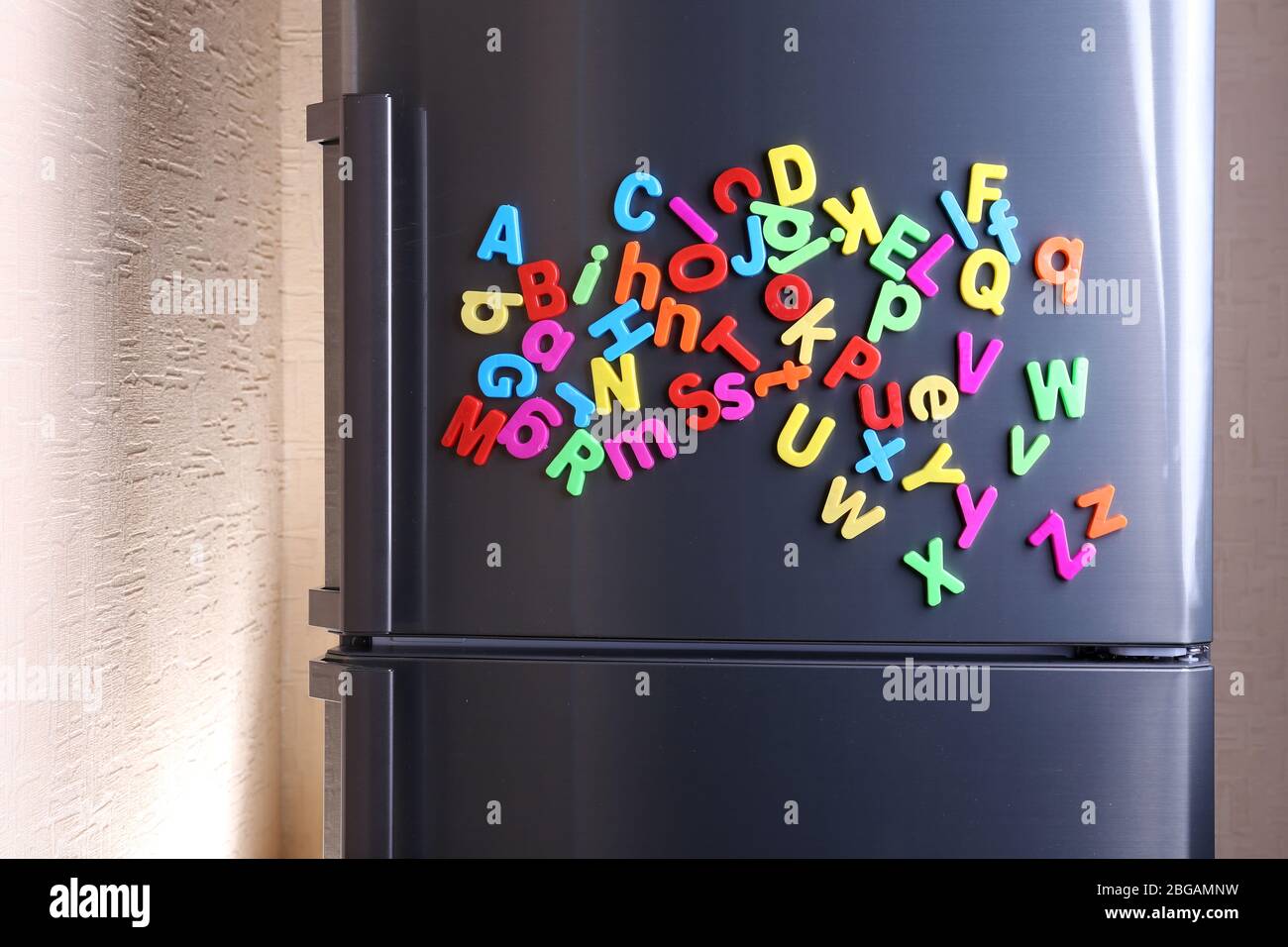 Colorful magnetic letters on refrigerator Stock Photo - Alamy