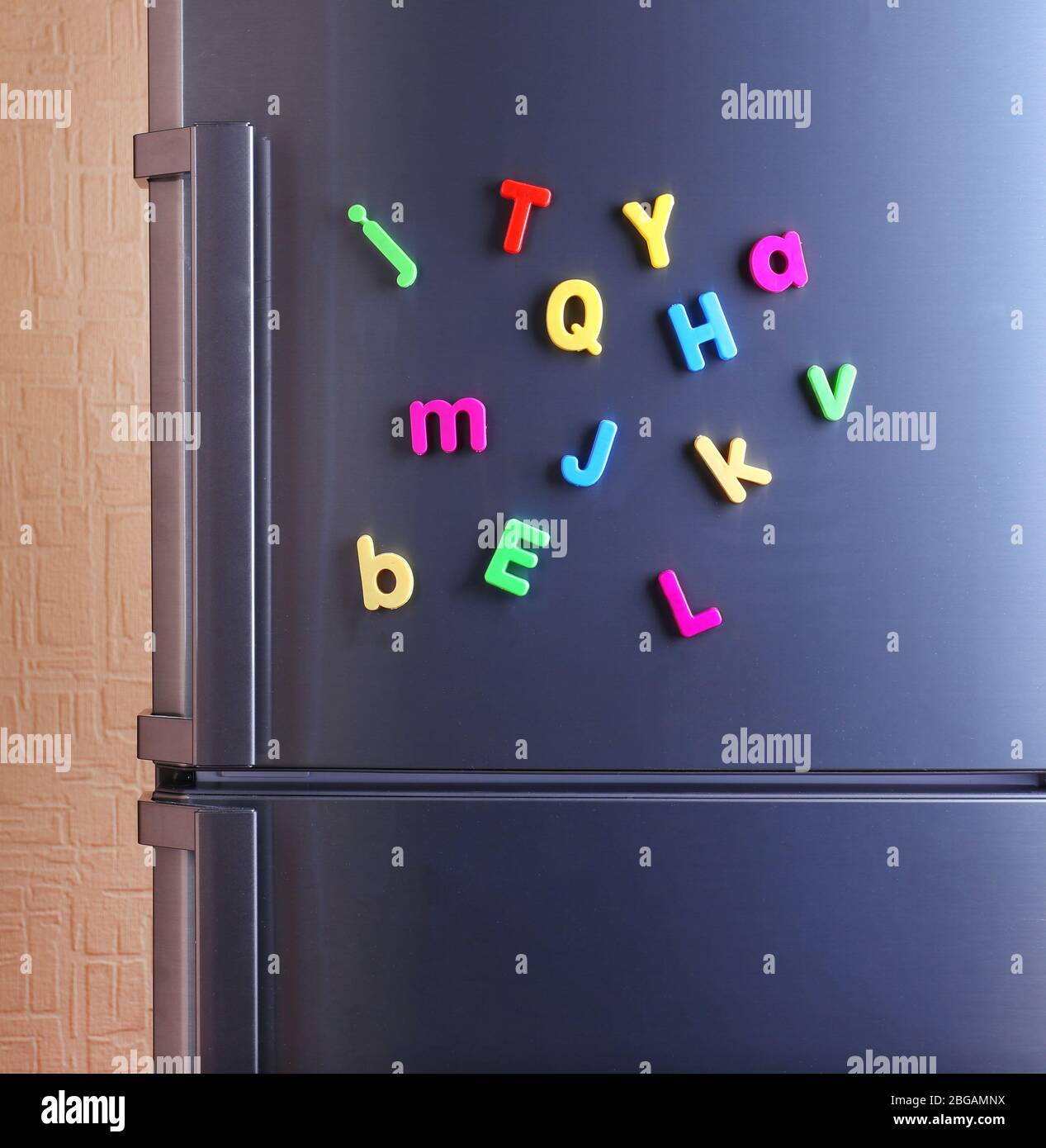 Colorful magnetic letters on refrigerator Stock Photo - Alamy