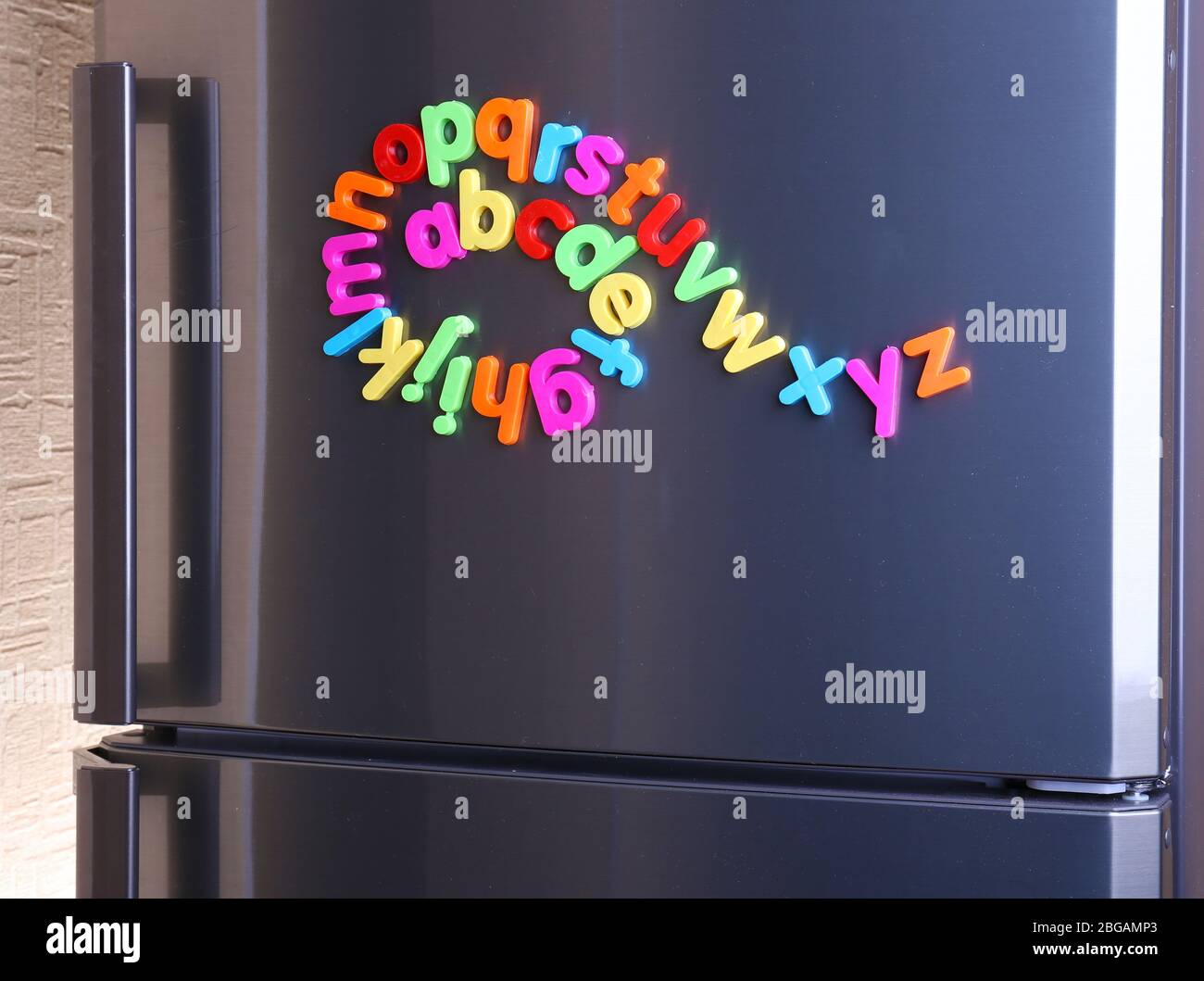 Colorful magnetic letters on refrigerator Stock Photo - Alamy