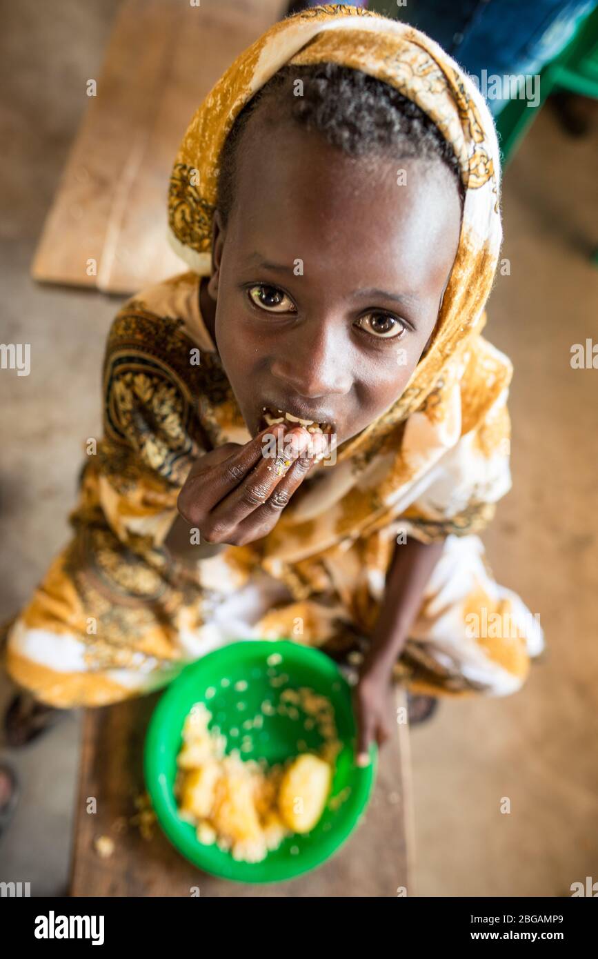 Child eating rice hands hi-res stock photography and images - Alamy